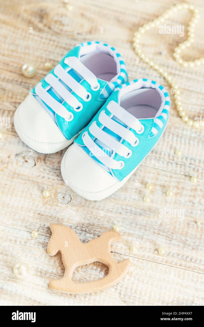 Baby booties accessories on a white background. People Stock Photo - Alamy