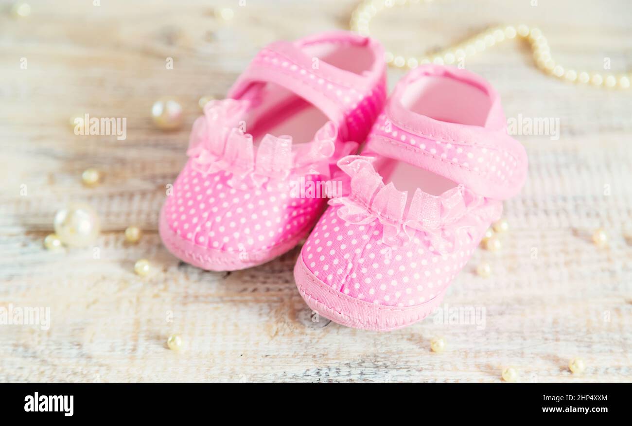 Baby booties accessories on a white background. People Stock Photo - Alamy