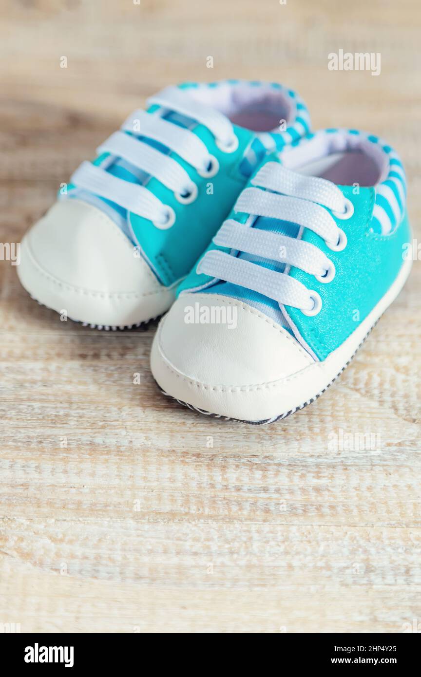 Baby booties accessories on a white background. People Stock Photo - Alamy