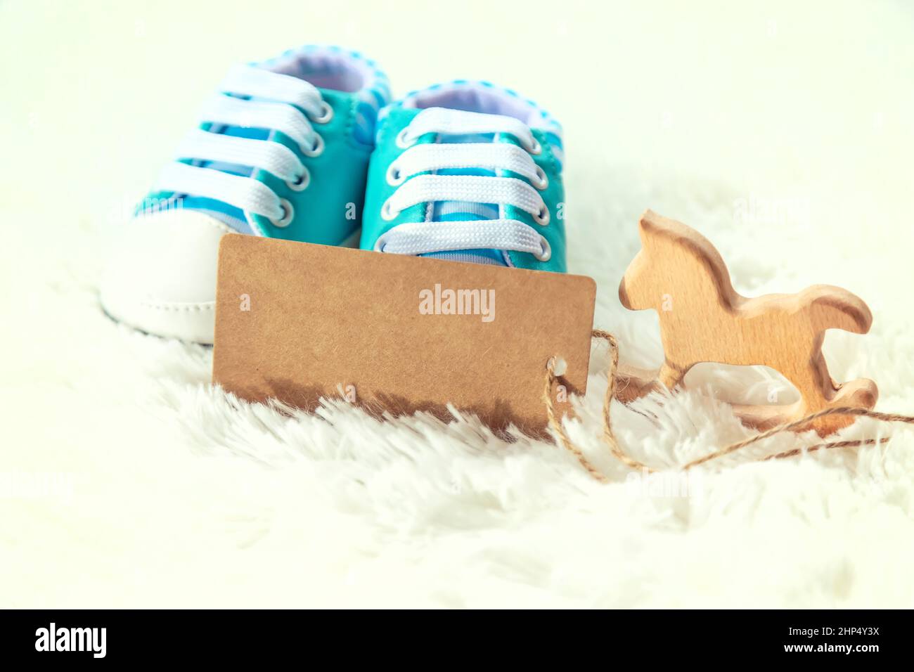 Baby booties accessories on a white background. People Stock Photo - Alamy