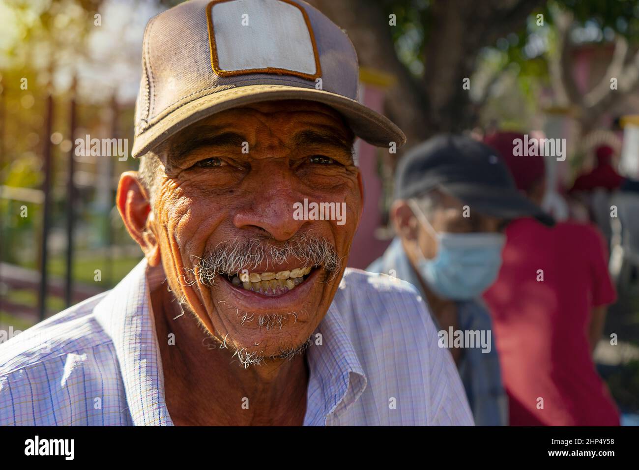 Elderly man from Latin America smiling and looking at the camera. The ...