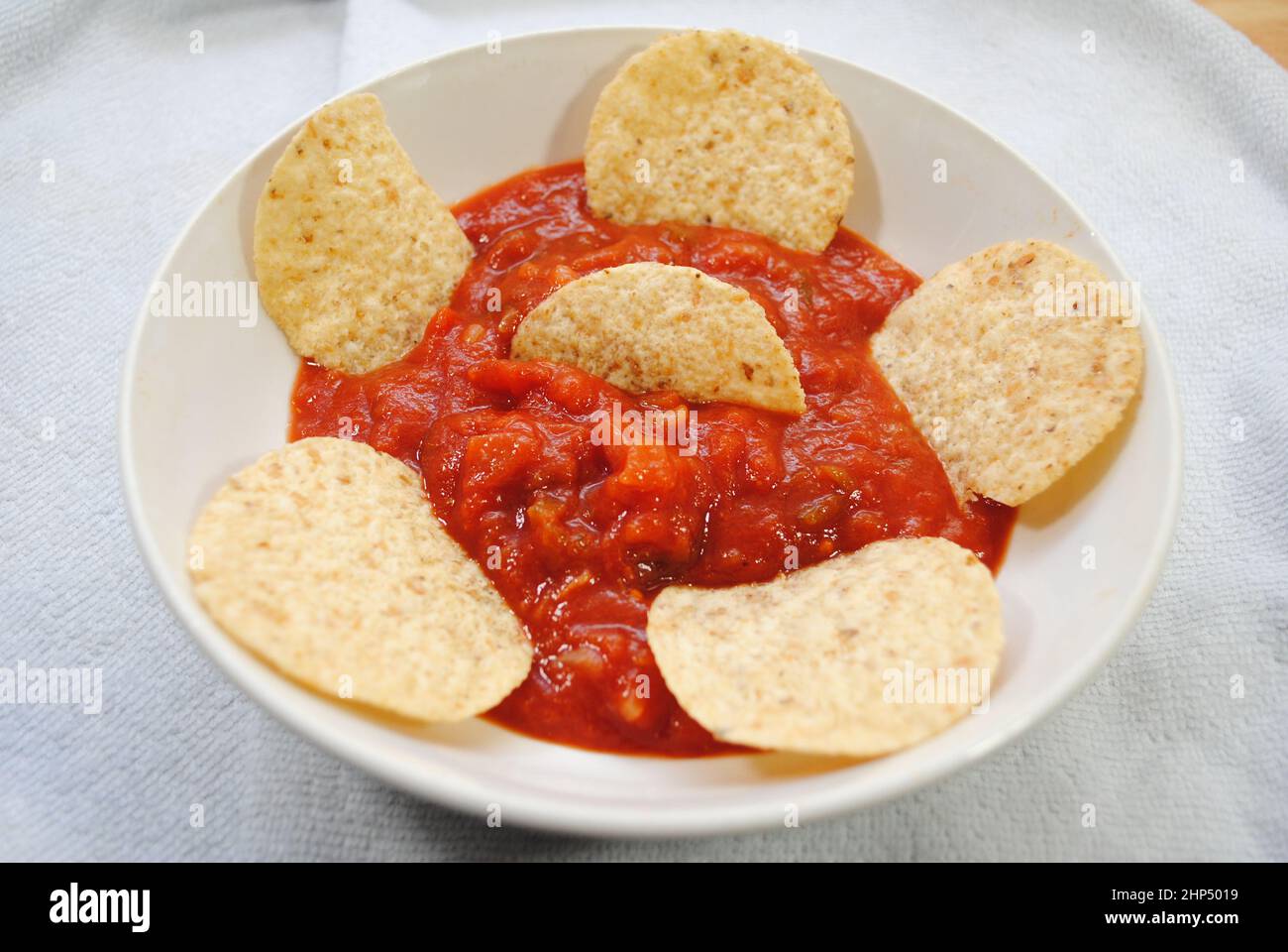 Tortilla Round Chips Served with Spicy Tomato Salsa Stock Photo - Alamy