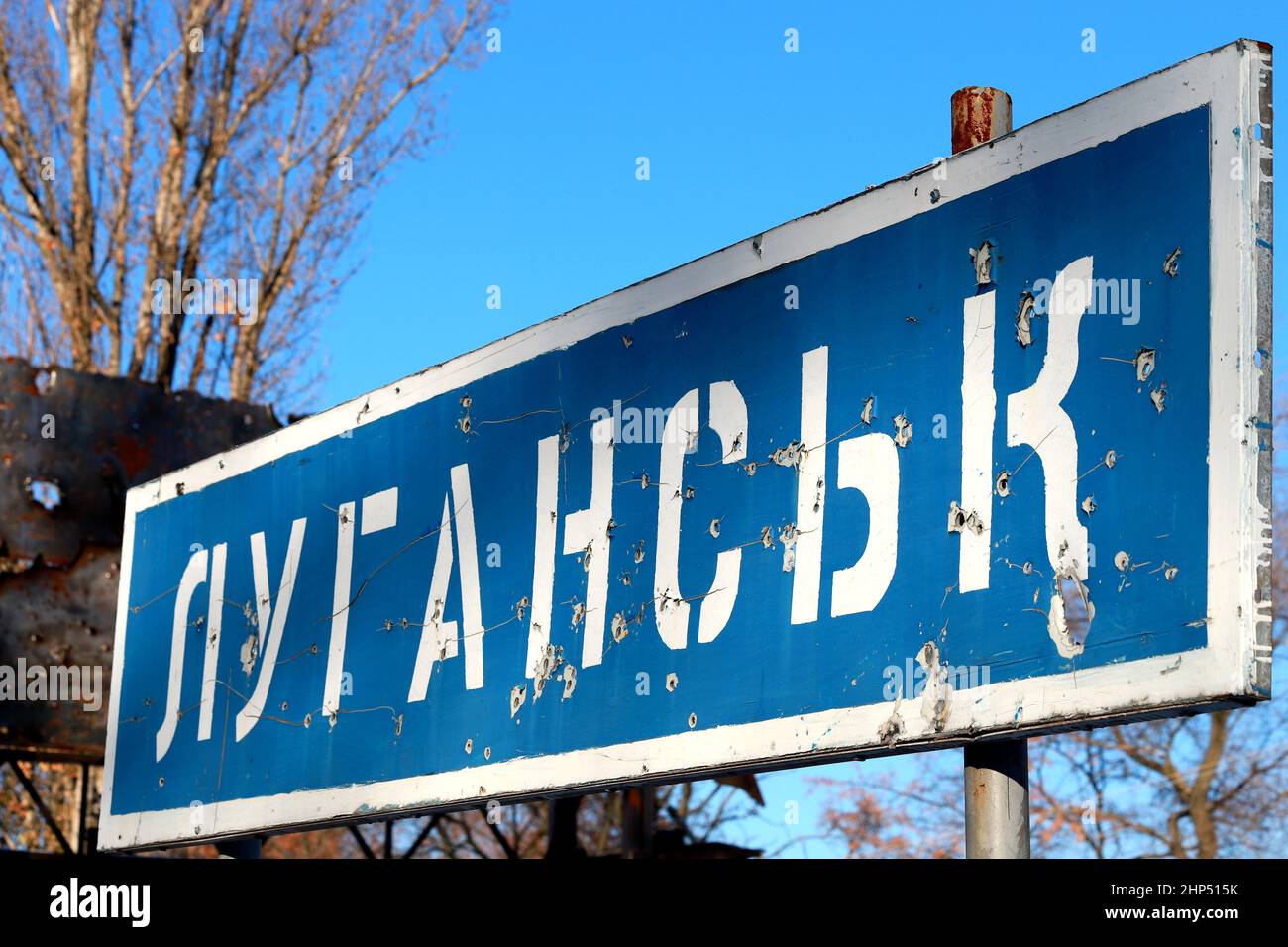 Ukraine Russia war, Road sign in Ukrainian - Lugansk, pierced by ...