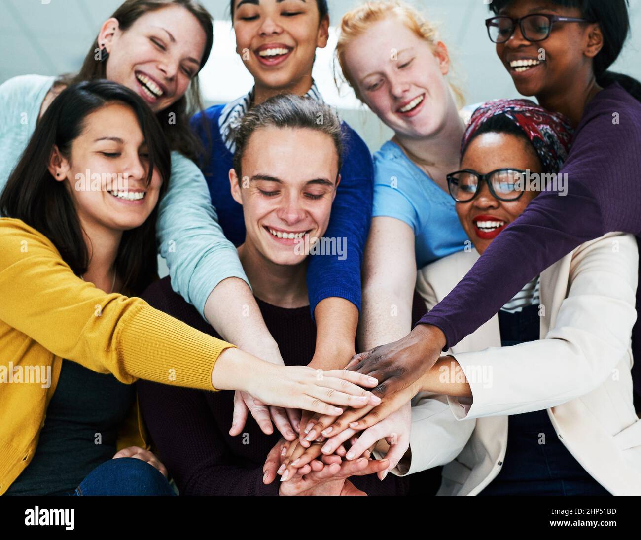 Together we can complete any task. Low angle shot of a group of ...