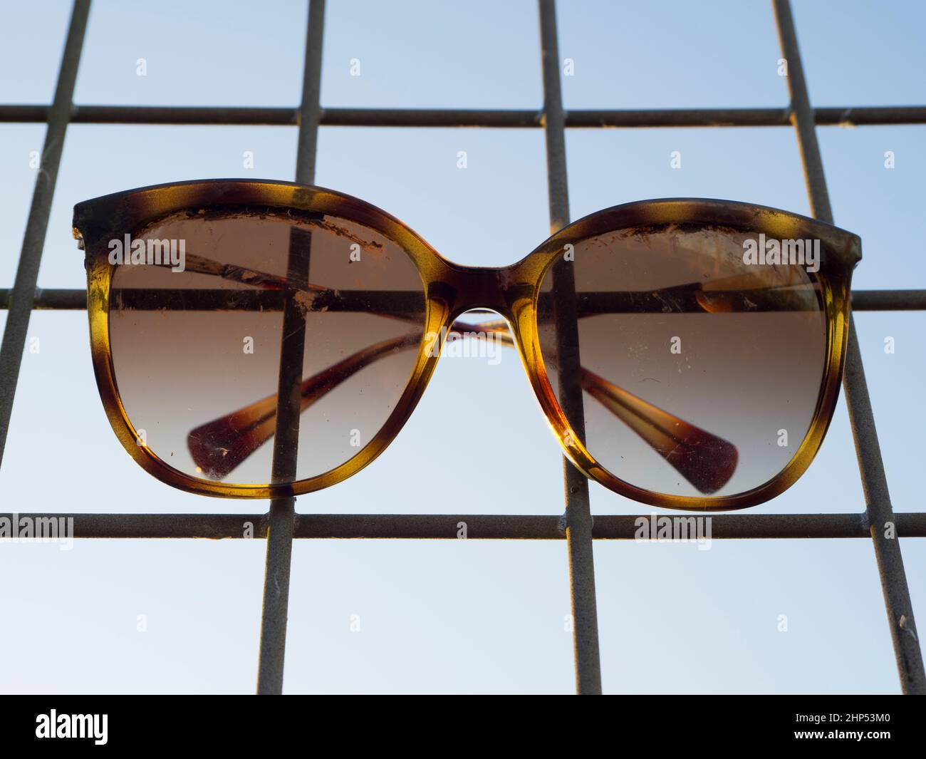 Suspended on metal fence hi-res stock photography and images - Alamy