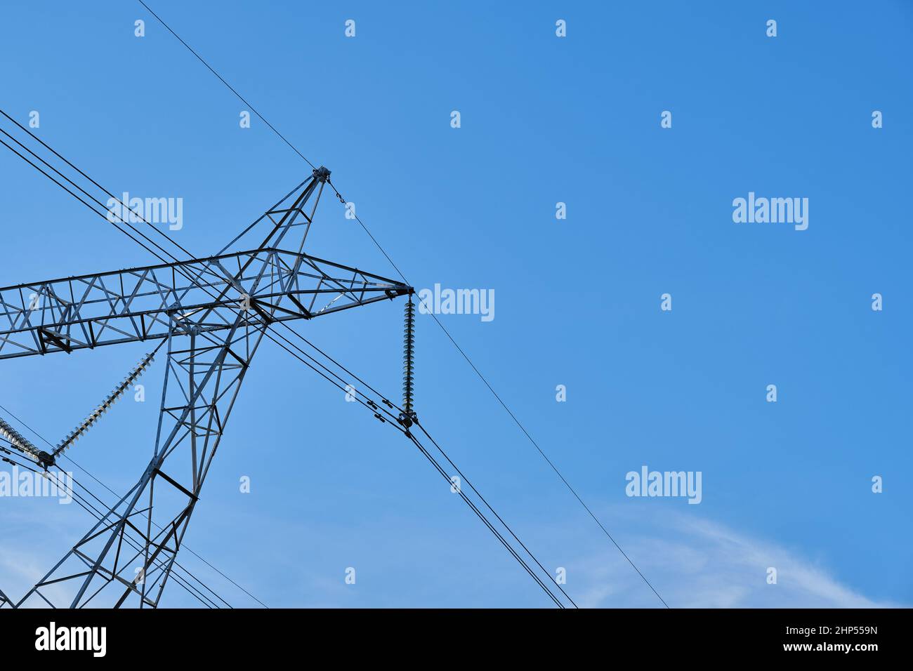 Close up of high Electrical power pylons of high-tension electricity ...
