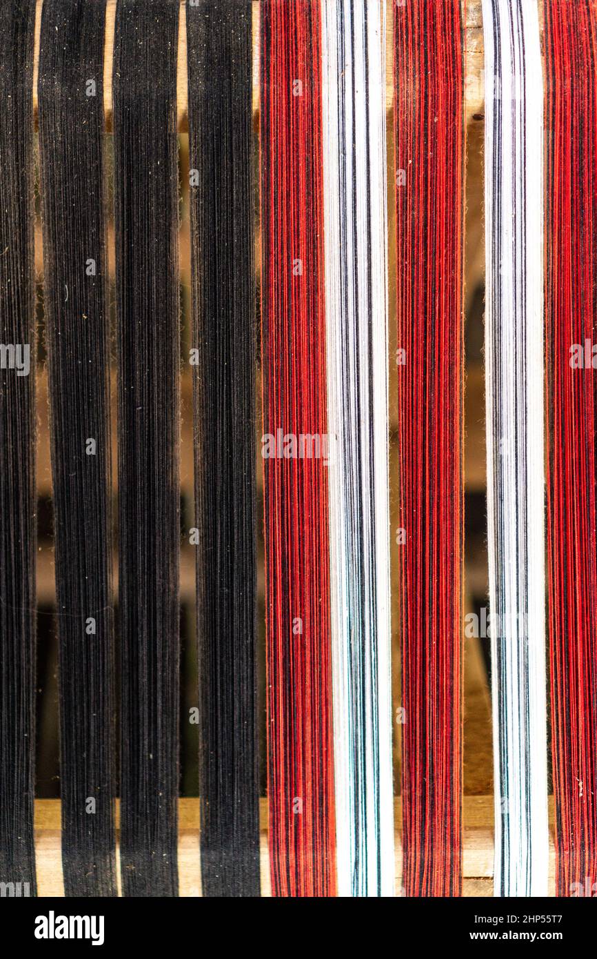 Closeup image of colorful strands of traditional weaving by the Karen ...