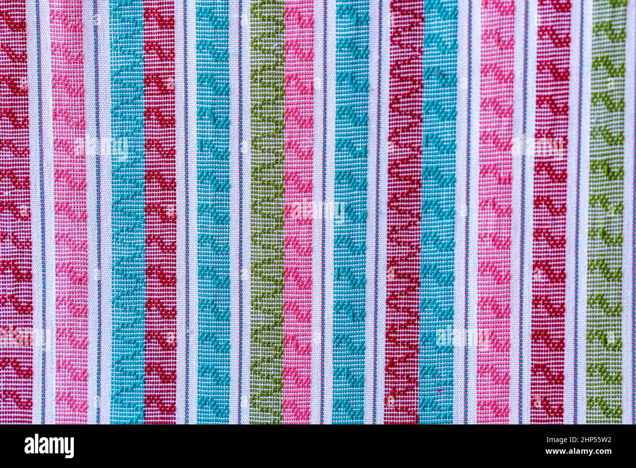 Closeup image of colorful strands of traditional weaving by the Karen ...
