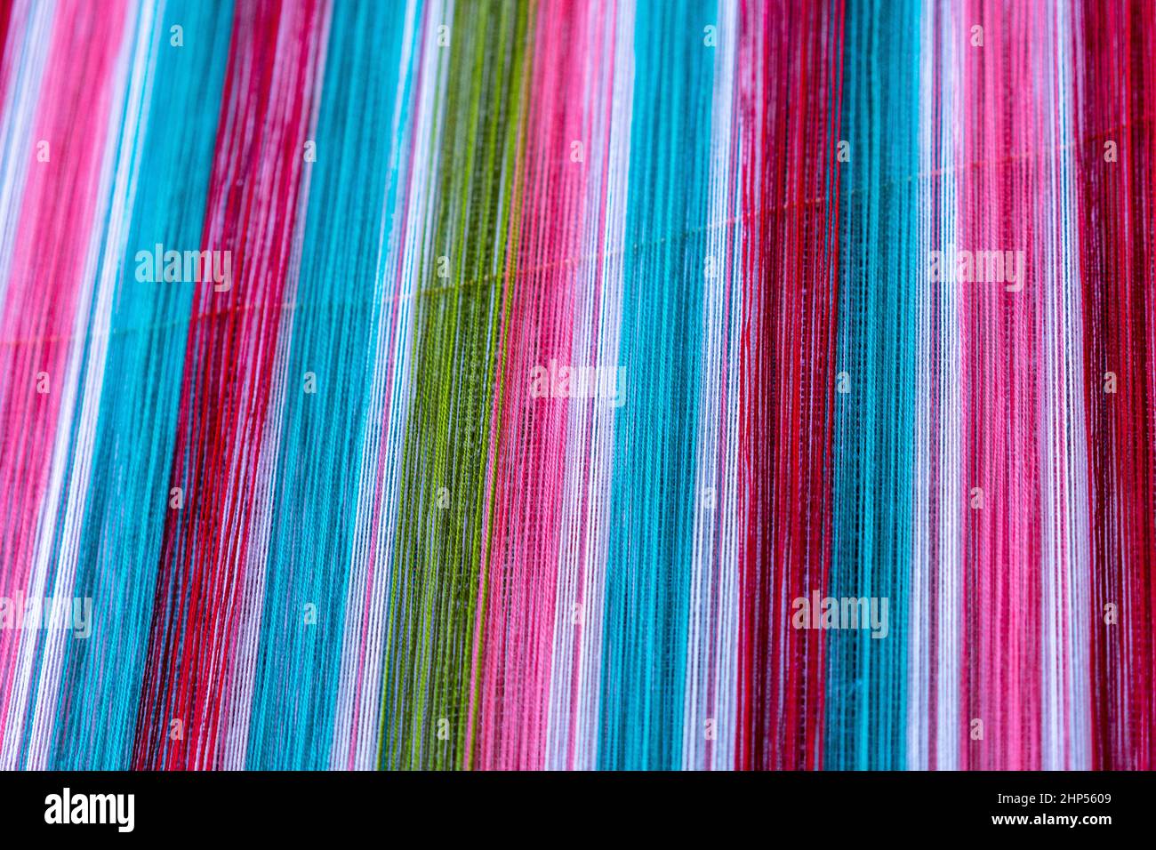 Closeup image of colorful strands of traditional weaving by the Karen ...