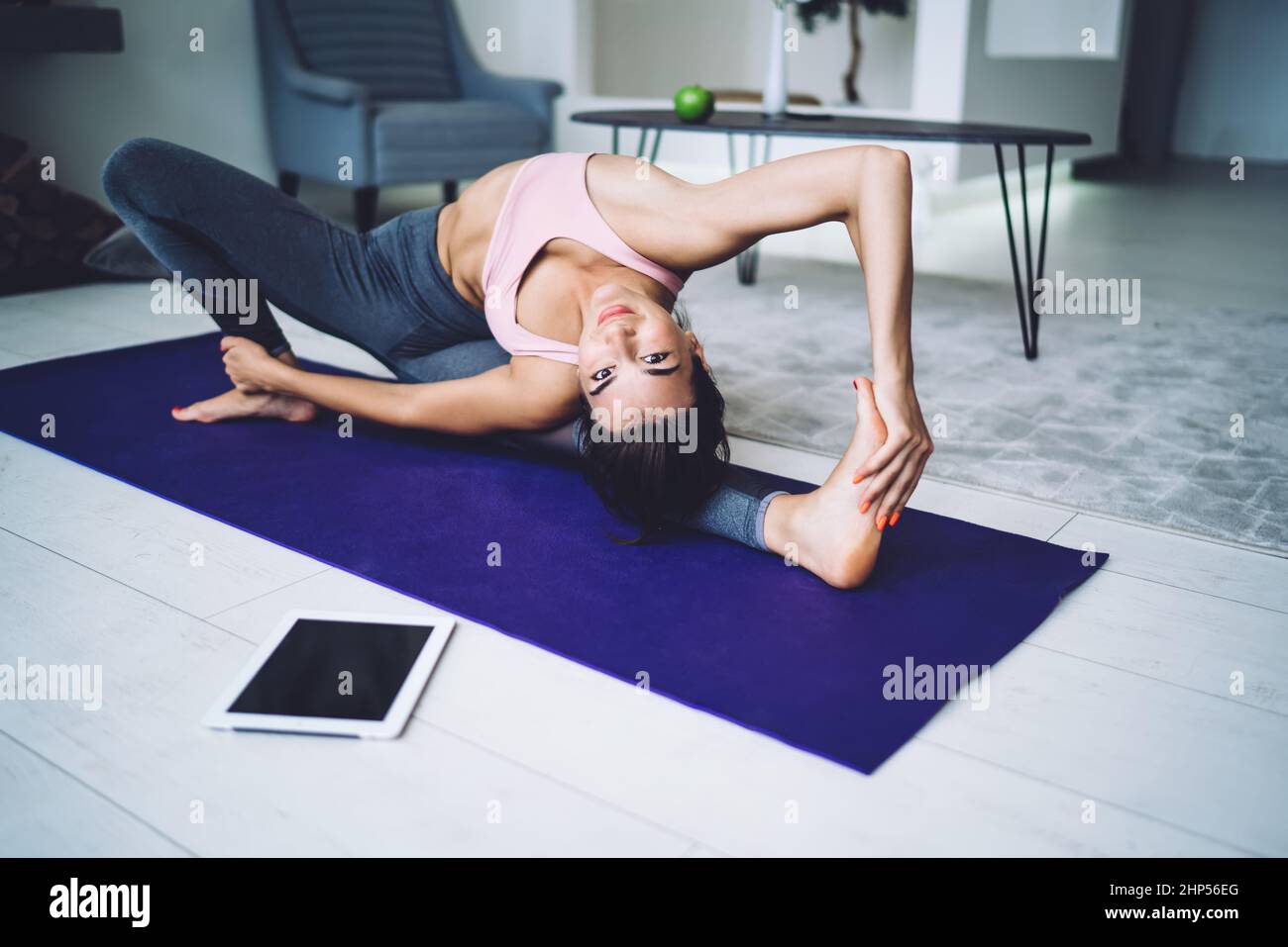 Sportive athletic yogi training flexible muscles during inspiration ...