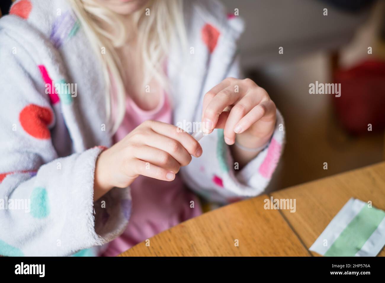 Child testing herself for coronavirus at home. Rapid COVID-19 Antigen ...