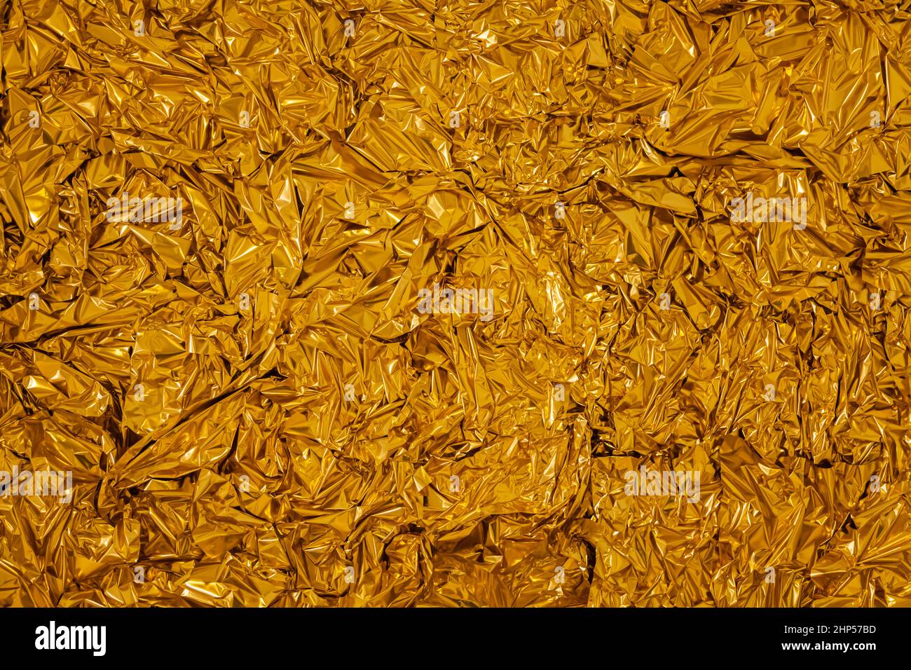 Crumpled gold foil background Stock Photo - Alamy