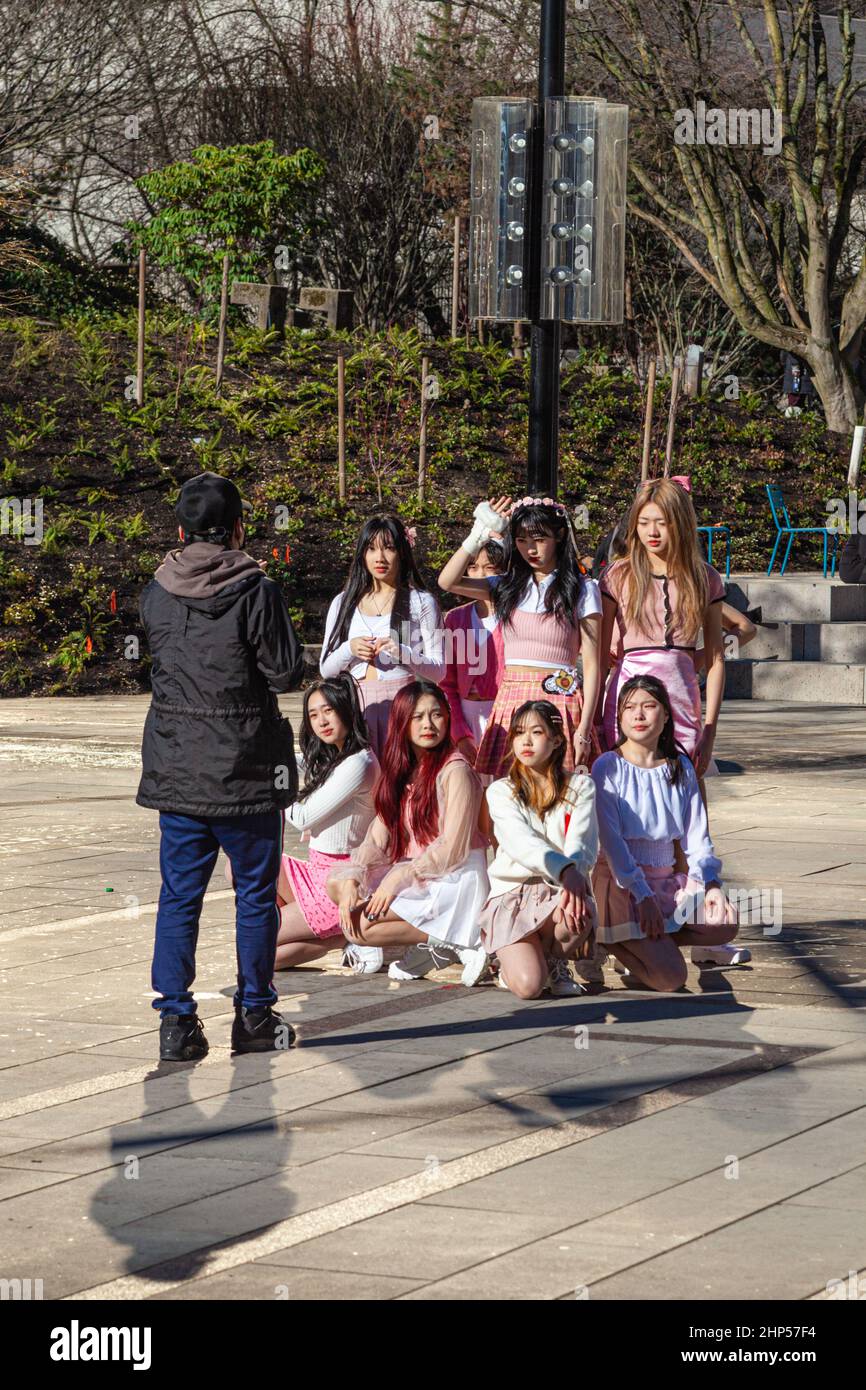Asian girl dance troupe performimg and posing at Robson Square in ...