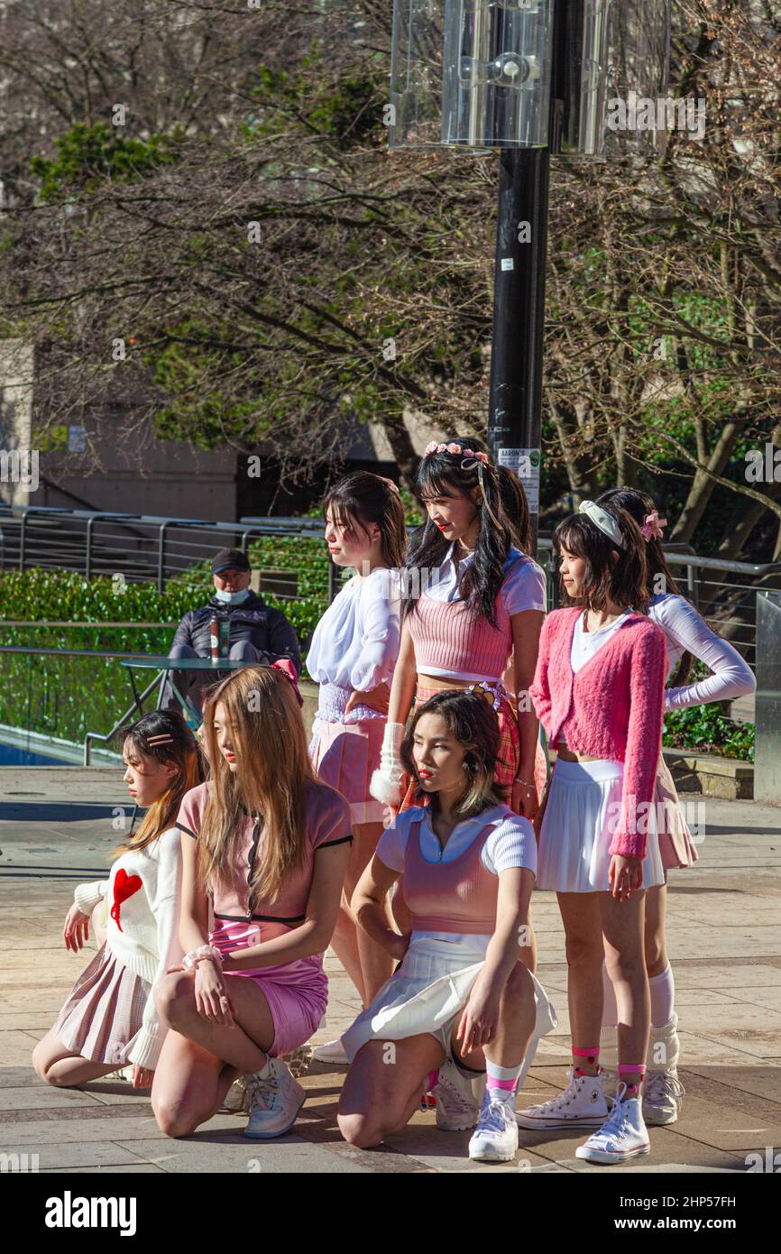 Asian girl dance troupe performimg and posing at Robson Square in ...