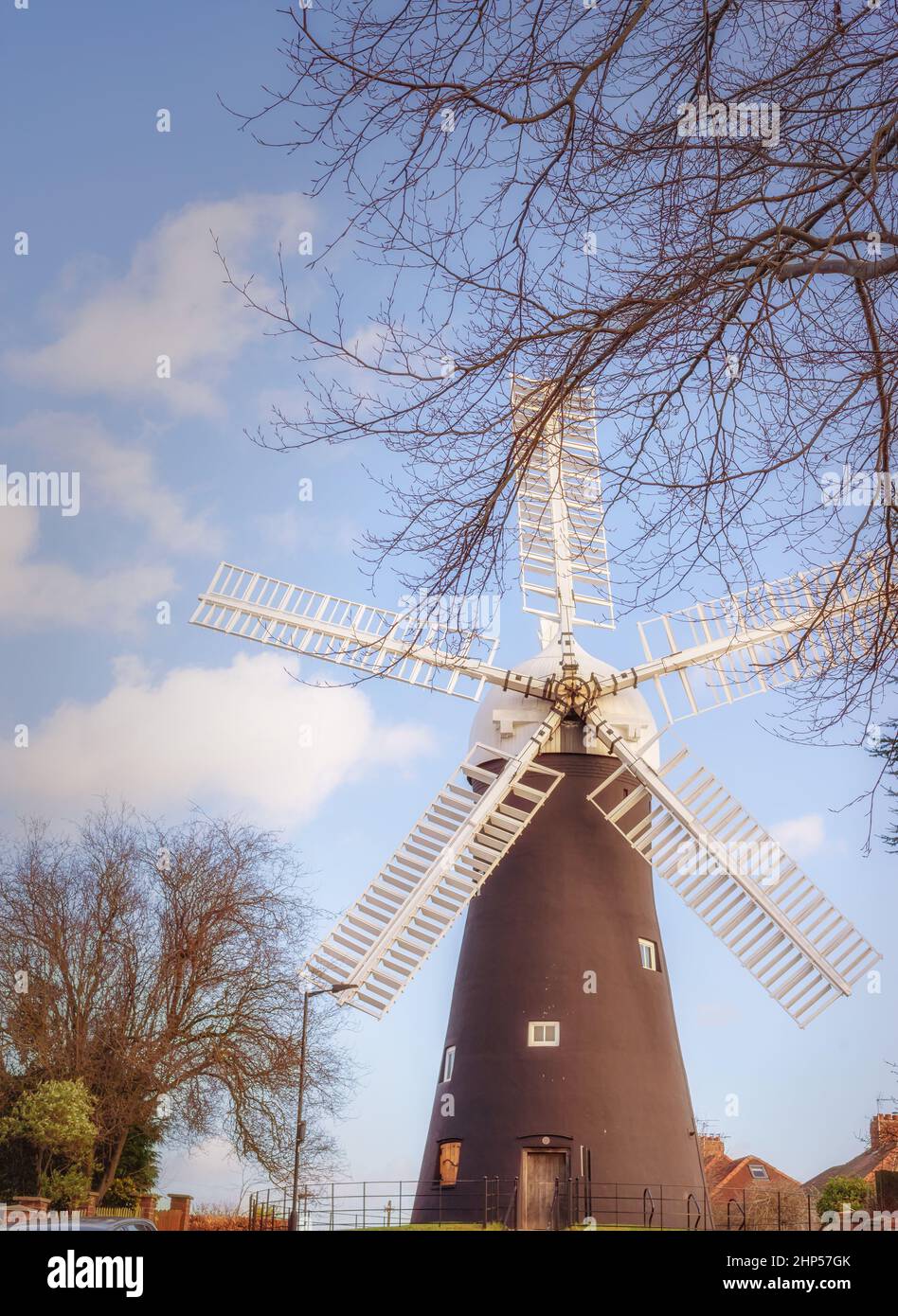 A 18th Century working windmill set in a residential street. There are ...