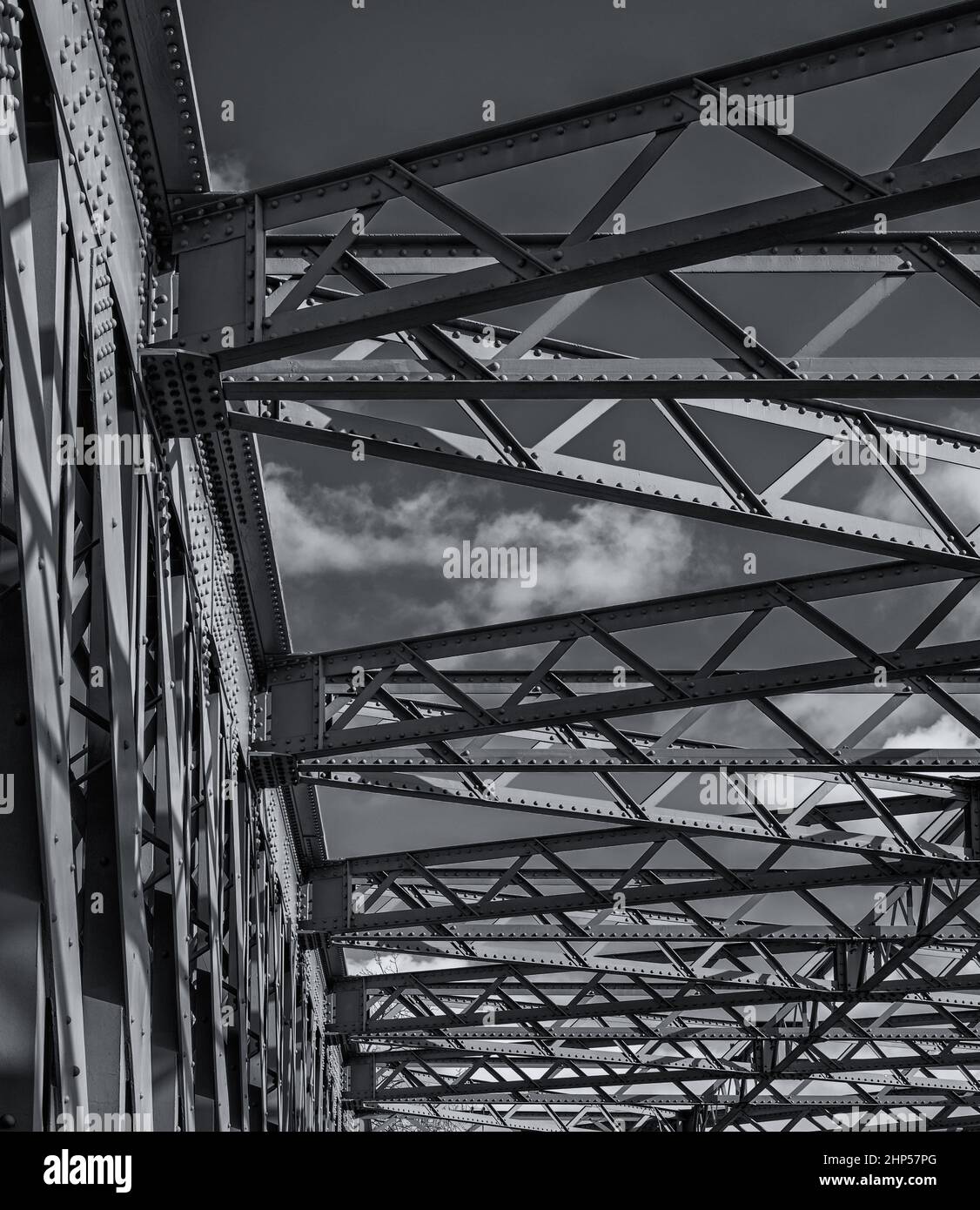 An upward view of an iron road bridge, completed in 1911, over a ...