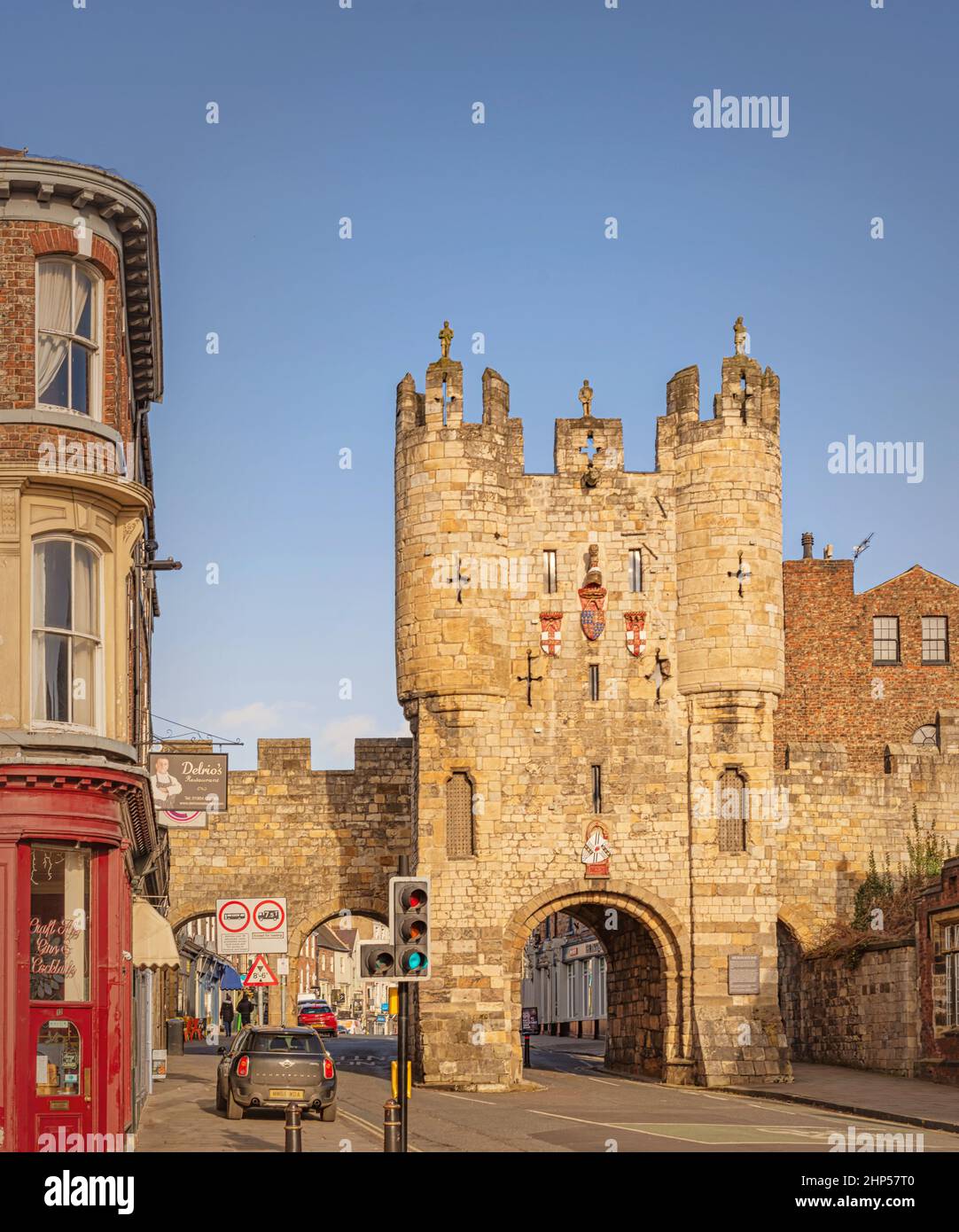 Medieval architecture of an ancient city gateway. Twin towers are above ...