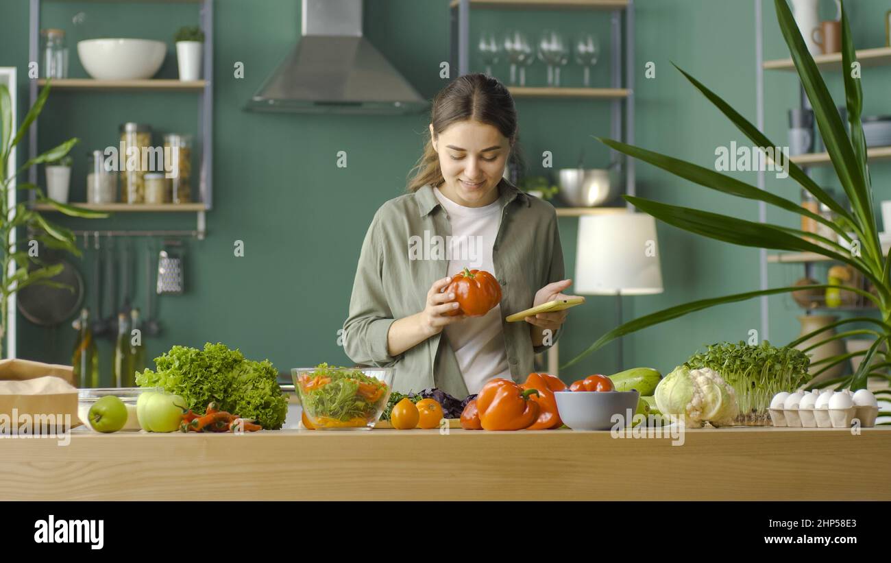 Young Woman Makes a Diet Plan of Correct Nutrition, Counts Calories ...