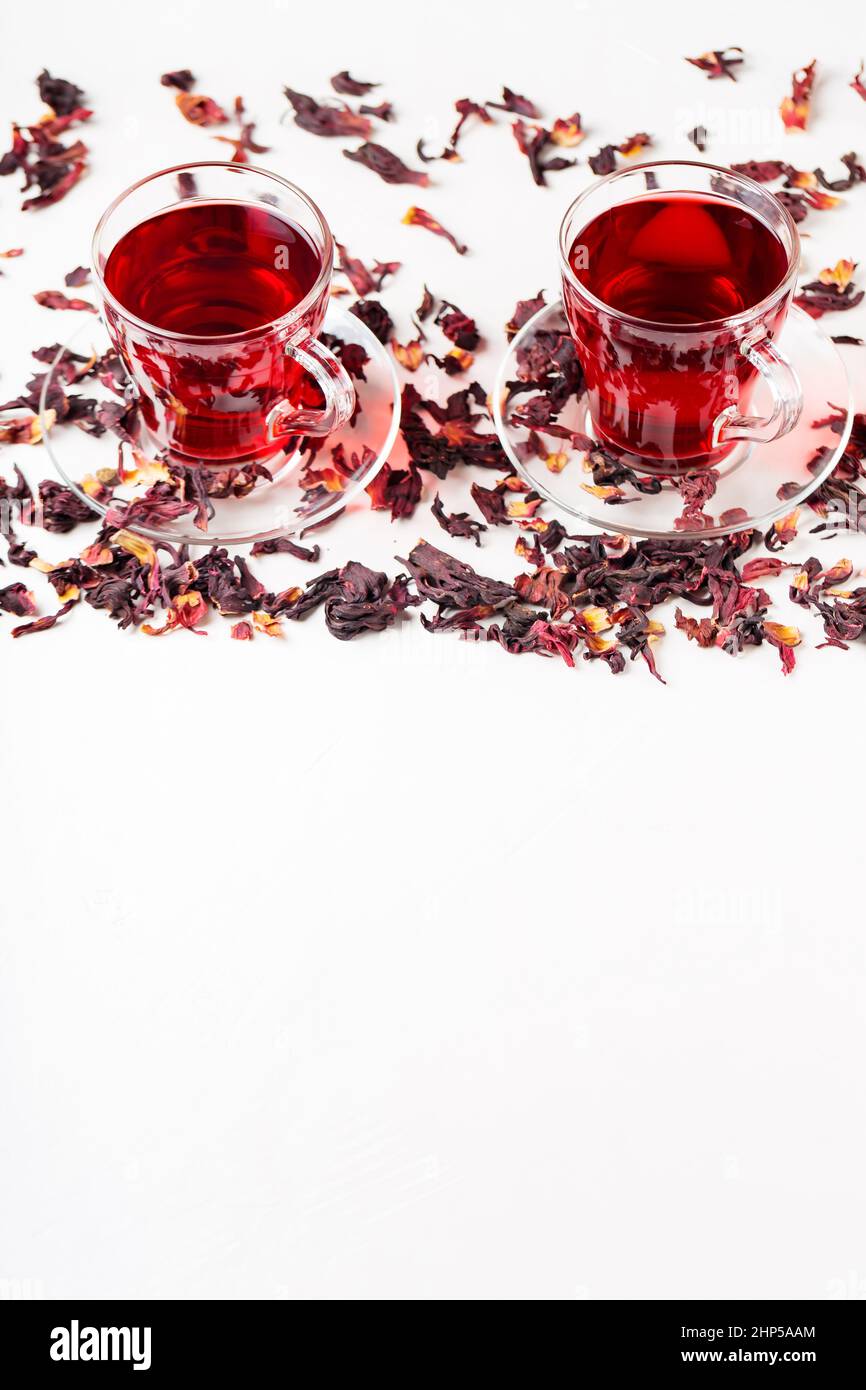 Cup of hibiscus tea (rosella, karkade, red sorrel) on a white ...