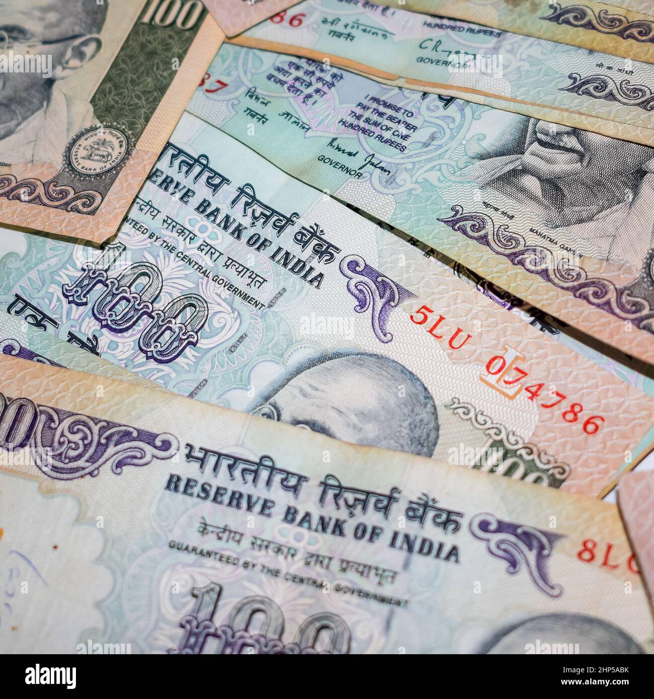 Old One Hundred Rupee notes combined on the table, India money on the ...