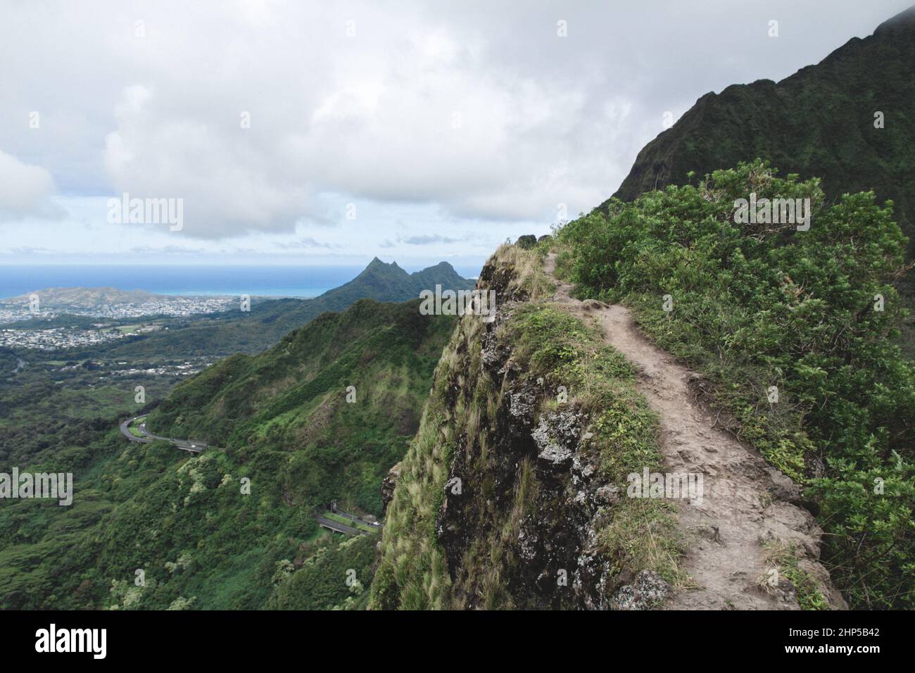 Mountain hiking trail along a cliffside Stock Photo - Alamy