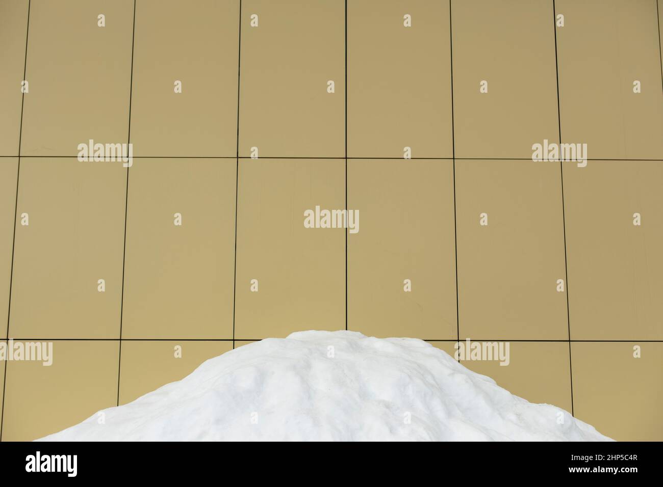 Snow against background of wall. Snow blockage. Pile of snow outside ...