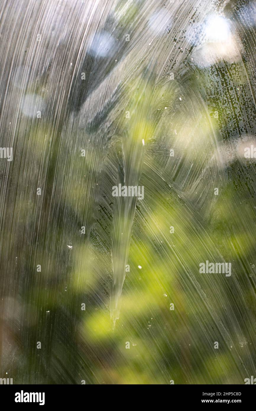 Dirty glass. Window is covered with dust. Plaque on surface. Cleaning ...