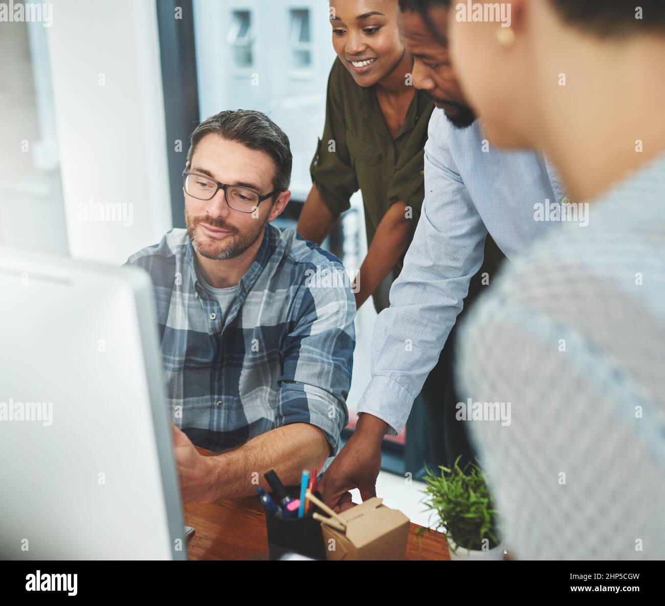 Working together to get the task done. Shot of businesspeople working ...