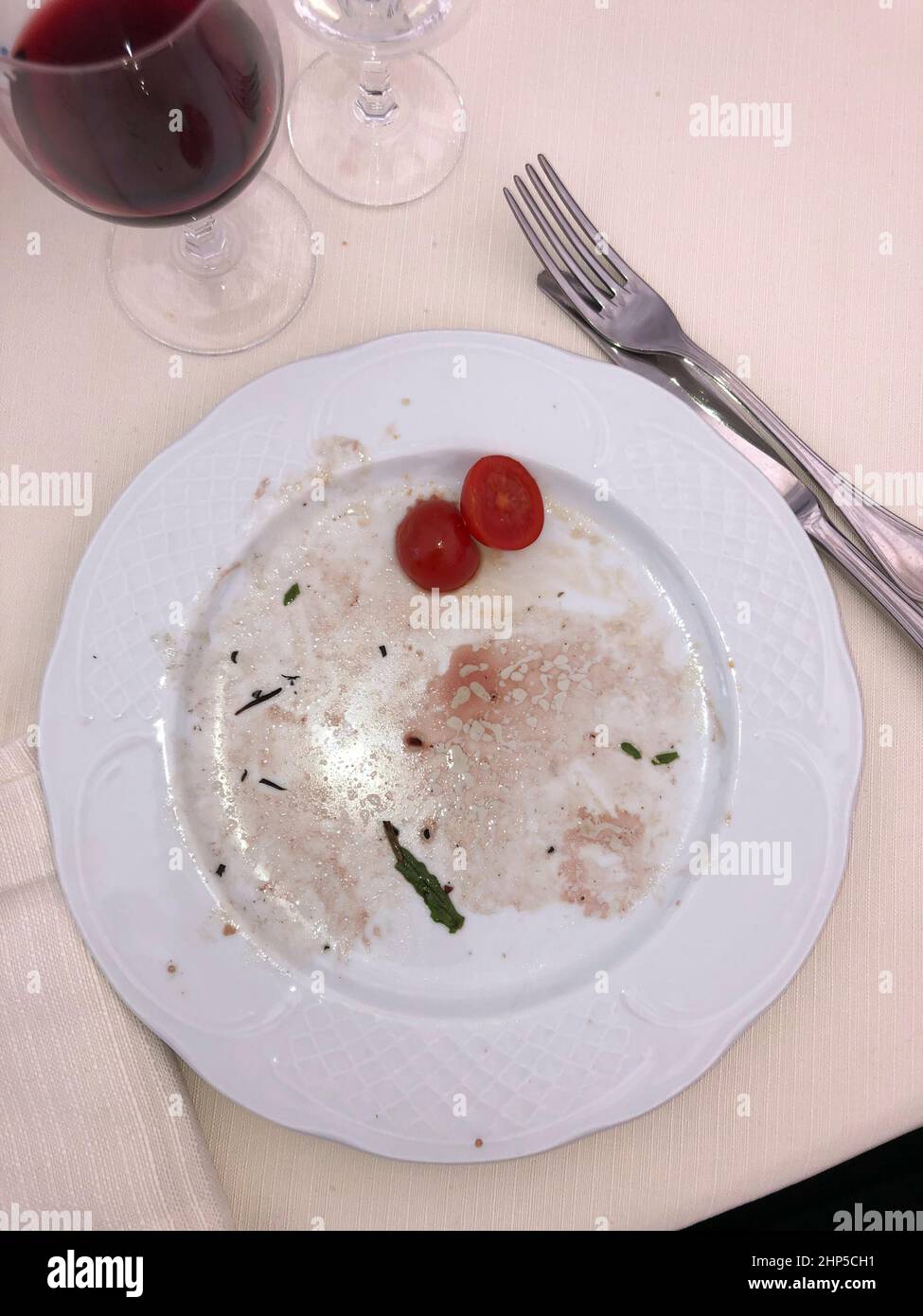 Plate after eating with food waste Stock Photo - Alamy