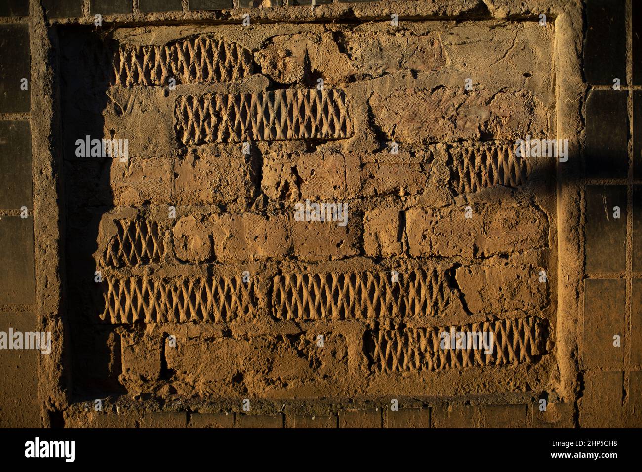 Details of old wall. Bricked passage. Window is closed with cement ...