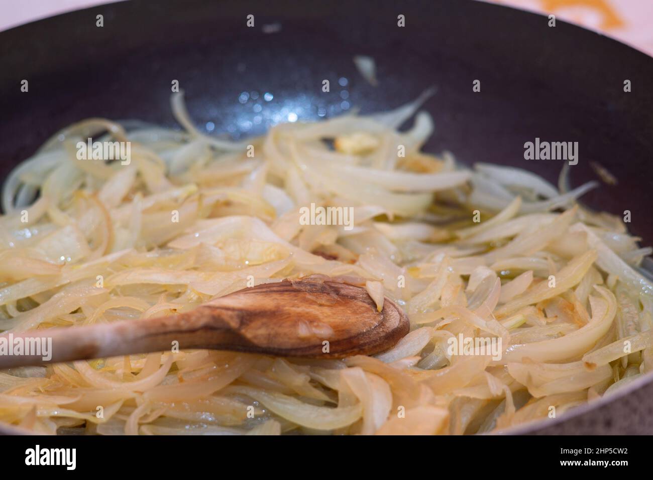 Cooking sliced onions in oil hi-res stock photography and images - Alamy
