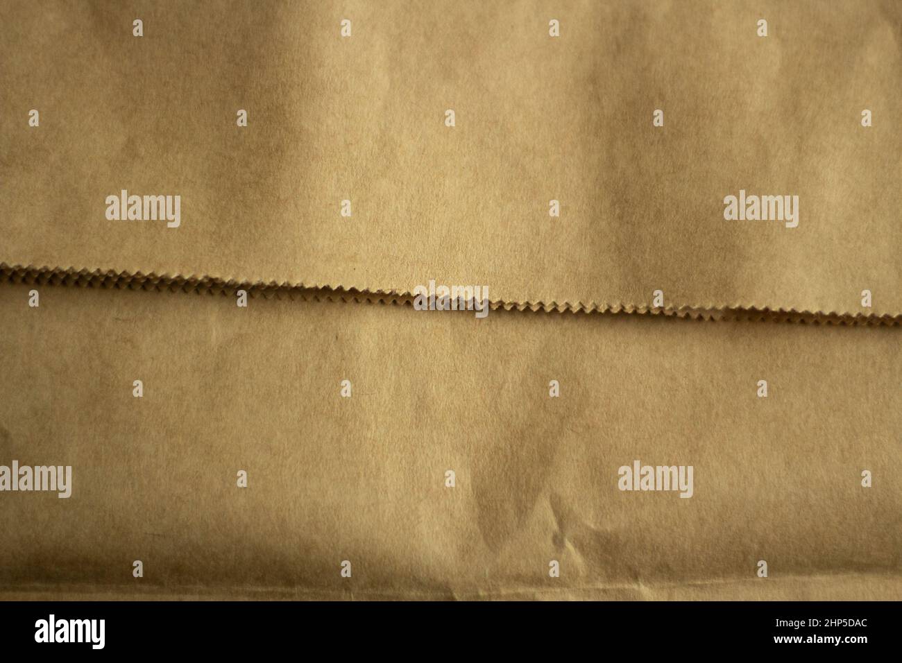 Craft paper. Brown wrapping paper. Fold in material. Cardboard texture ...