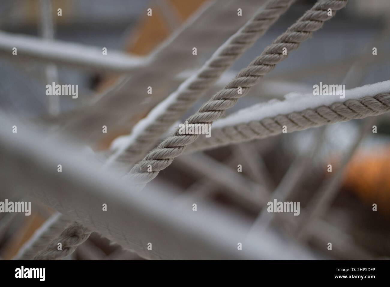 Tangled ropes. Crossing ropes. Texture of thread in snow. Labyrinth of ...