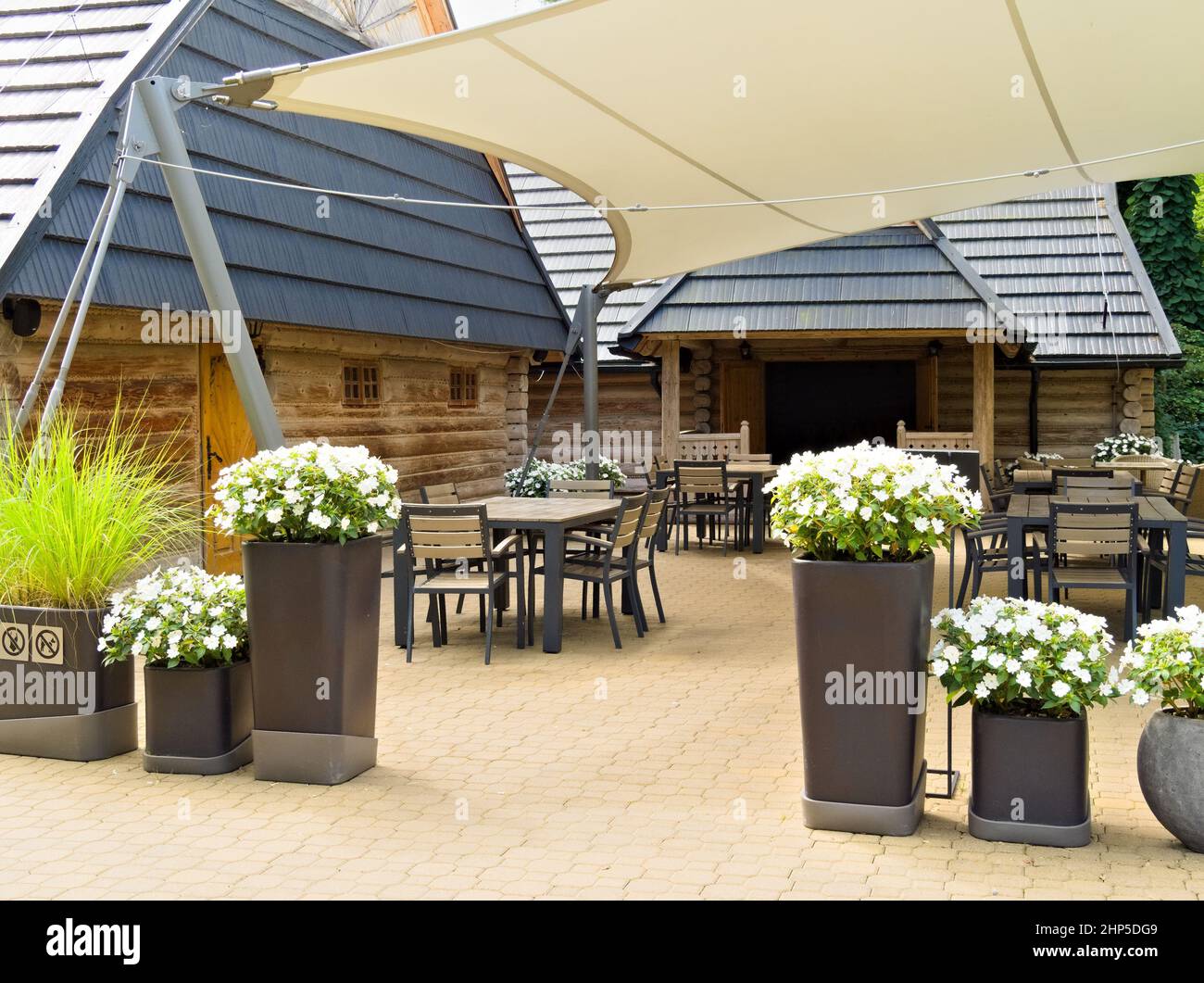 an open-air restaurant, a canvas roof, tables are waiting for the ...