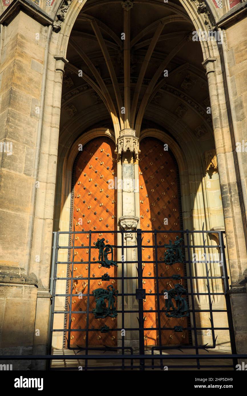 Gothic gate with large studded wooden doors and arches at St Vitus ...