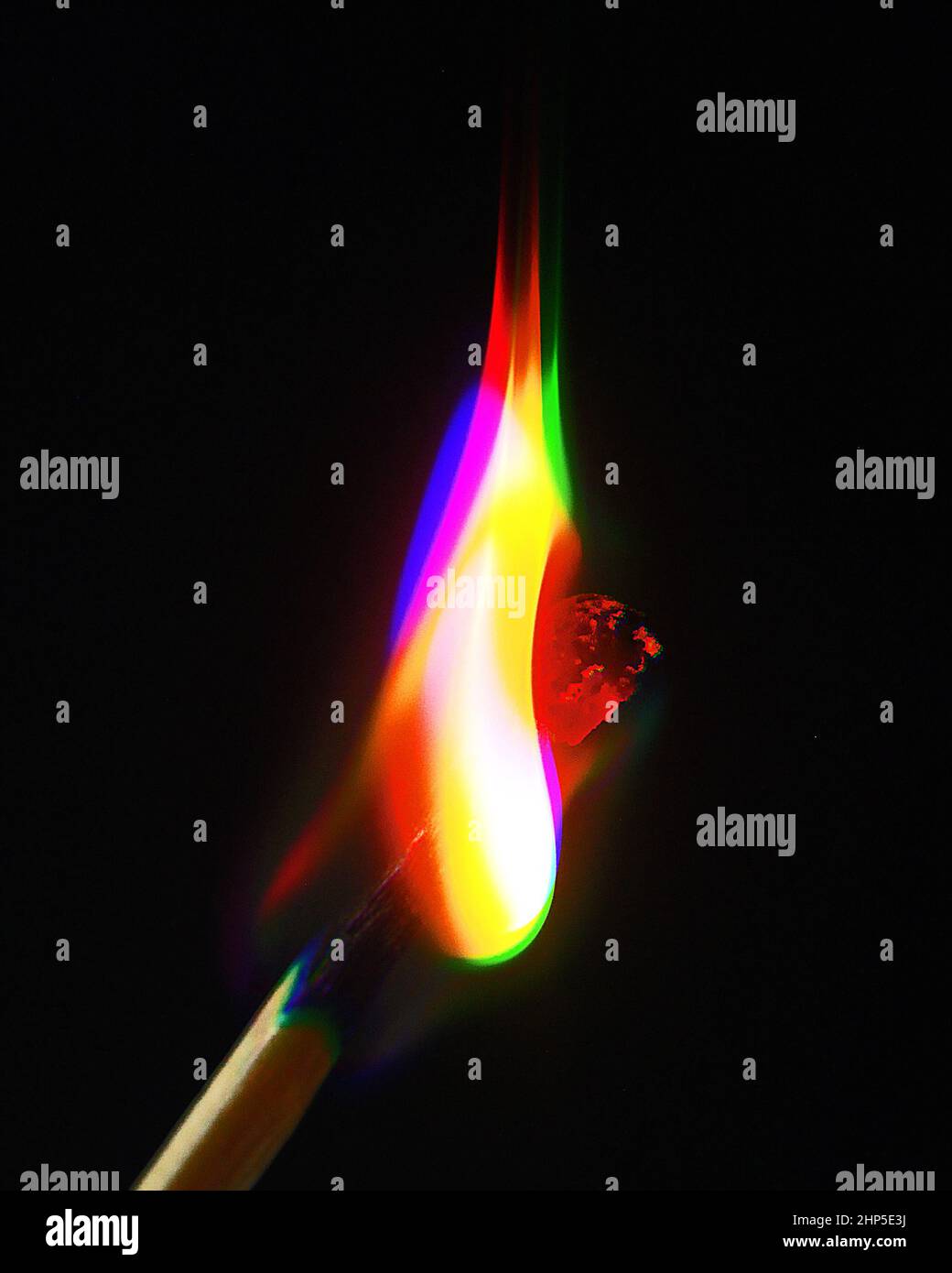 Multi-colored flame of a burning match in the dark background Stock ...
