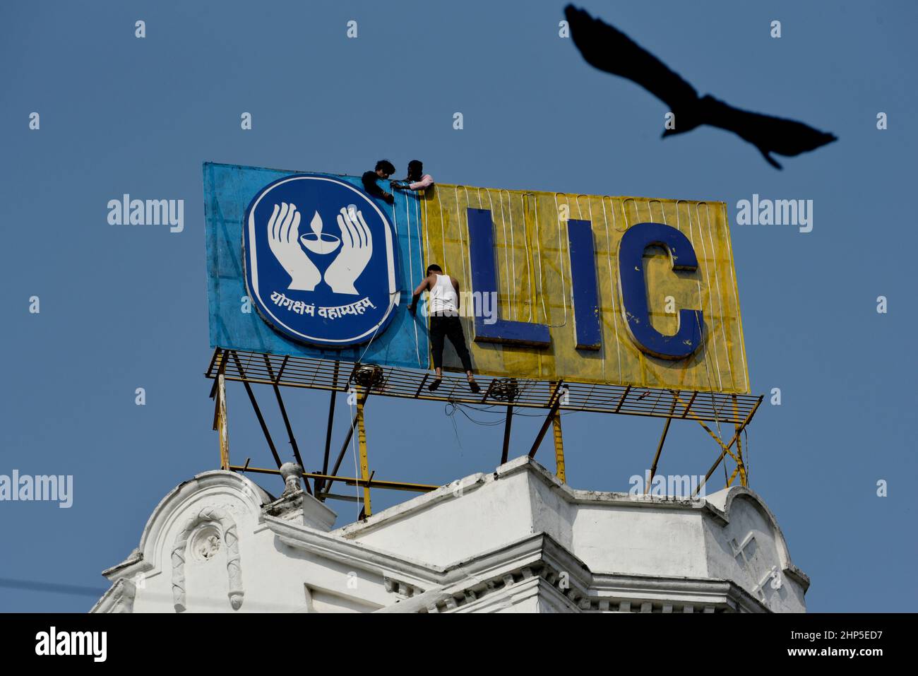 Kolkata, West Bengal, India. 18th Feb, 2022. A bird flies past LIC ...