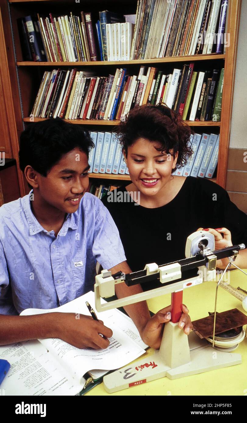 Austin, Texas USA,1990: High school students use a balance to weigh ...