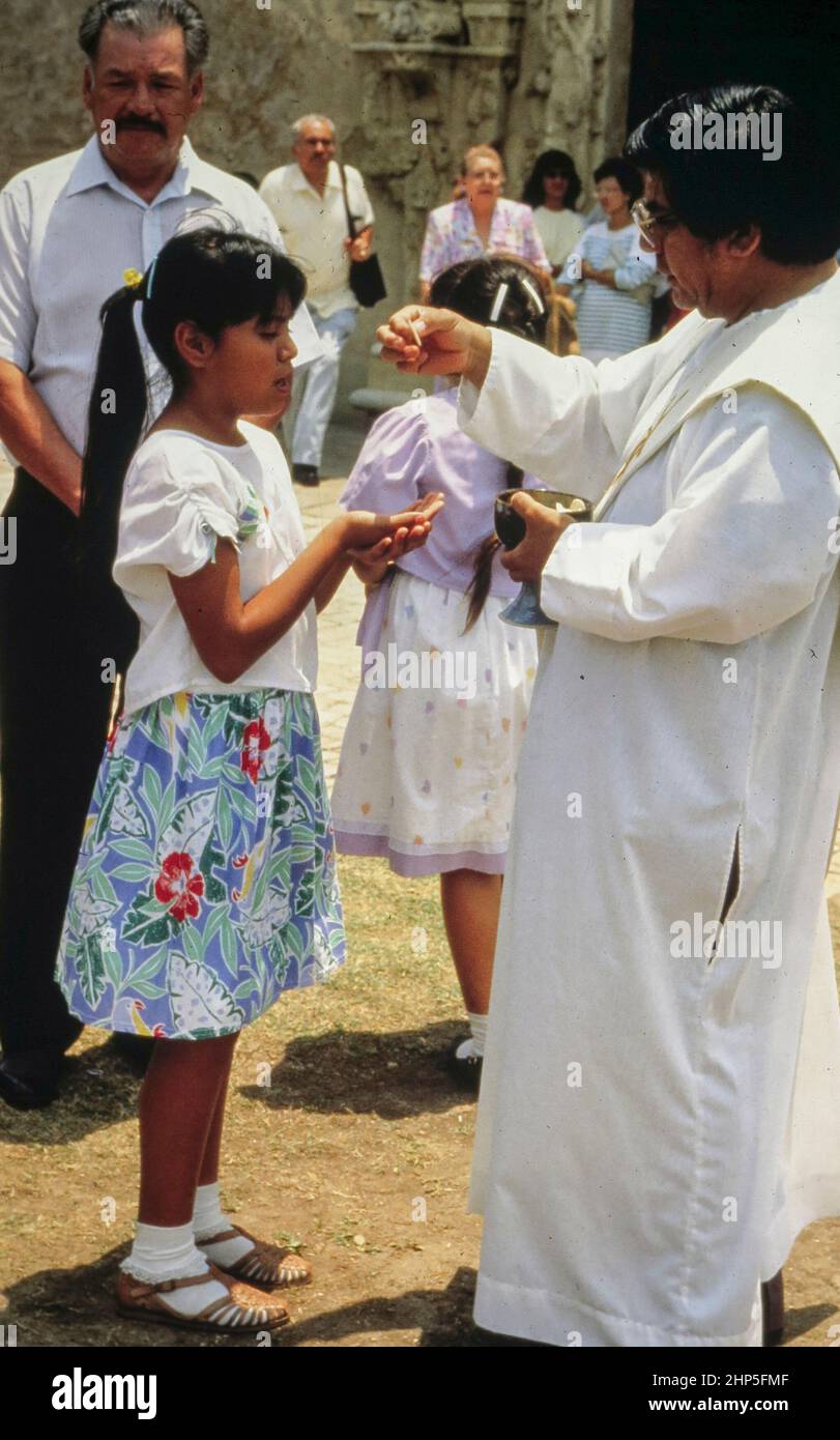 Teen receives communion hi-res stock photography and images - Alamy