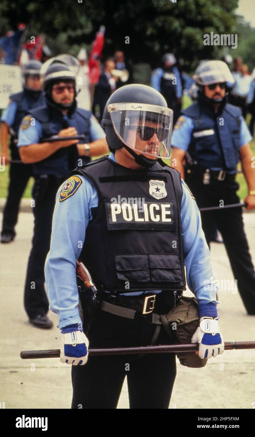Houston Texas USA, 1990: Police watch members of the Ku Klux Klan march ...