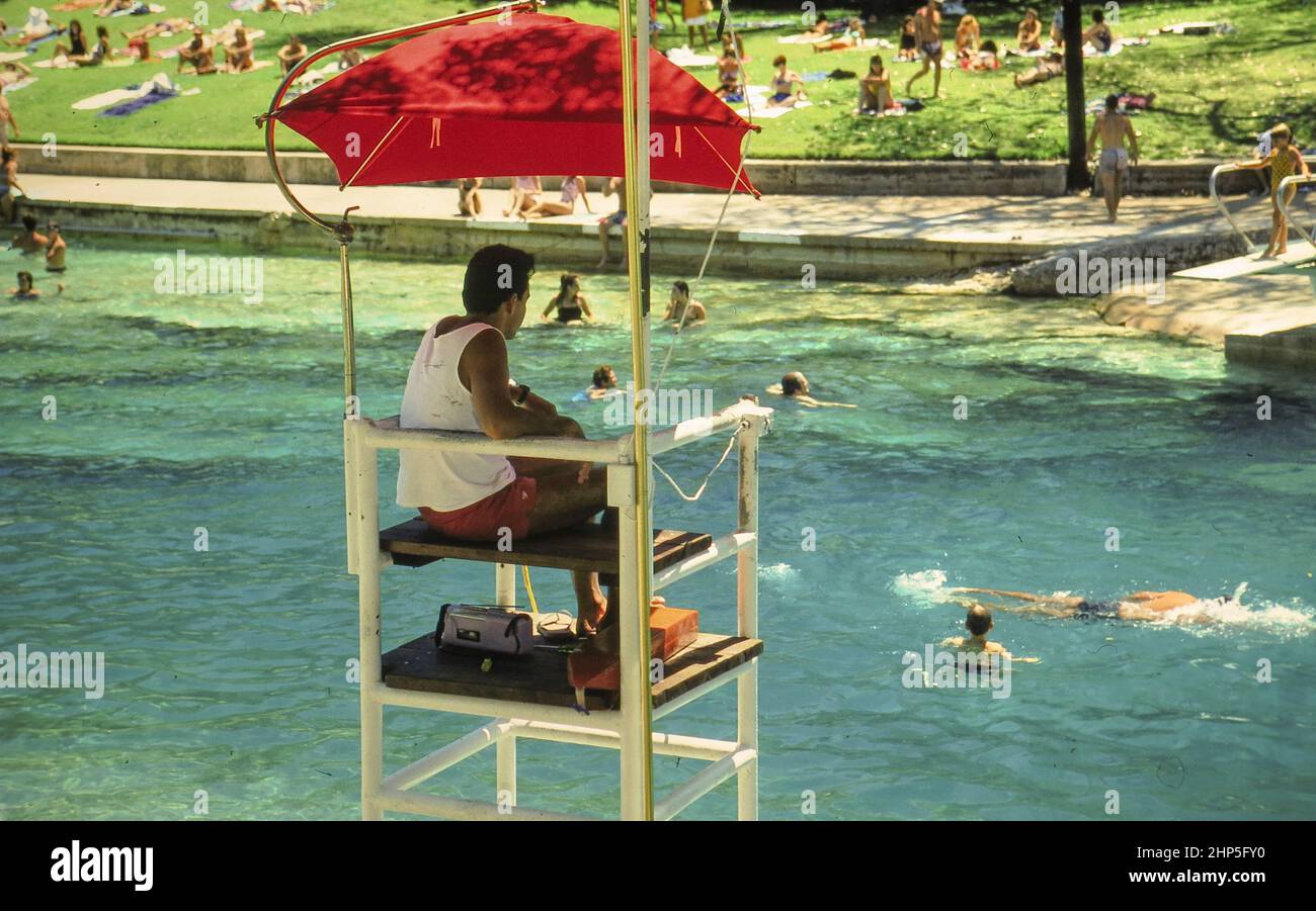 Austin Texas USA, 1993: Lifeguard watches over swimmers' safety in ...
