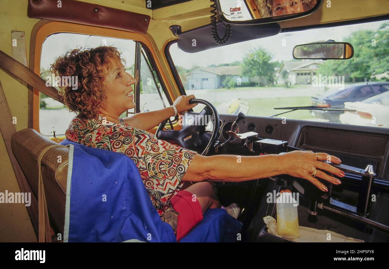 Austin Texas USA, 1995: Hispanic school bus driver Zonie Rios drives a ...