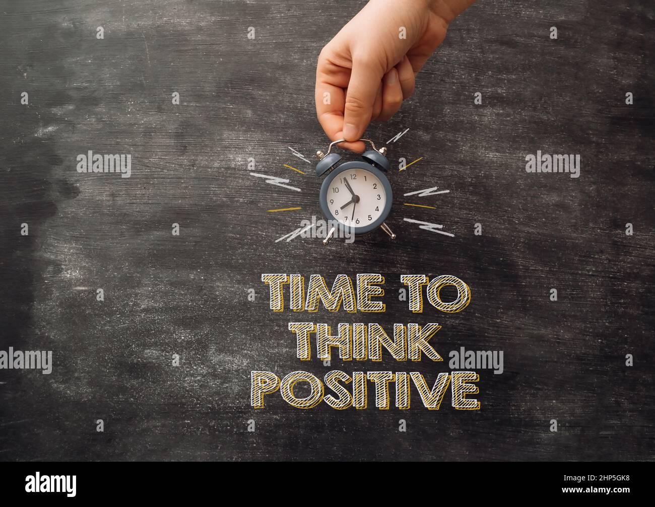 The inscription on a black chalk board - time to think positive. The ...