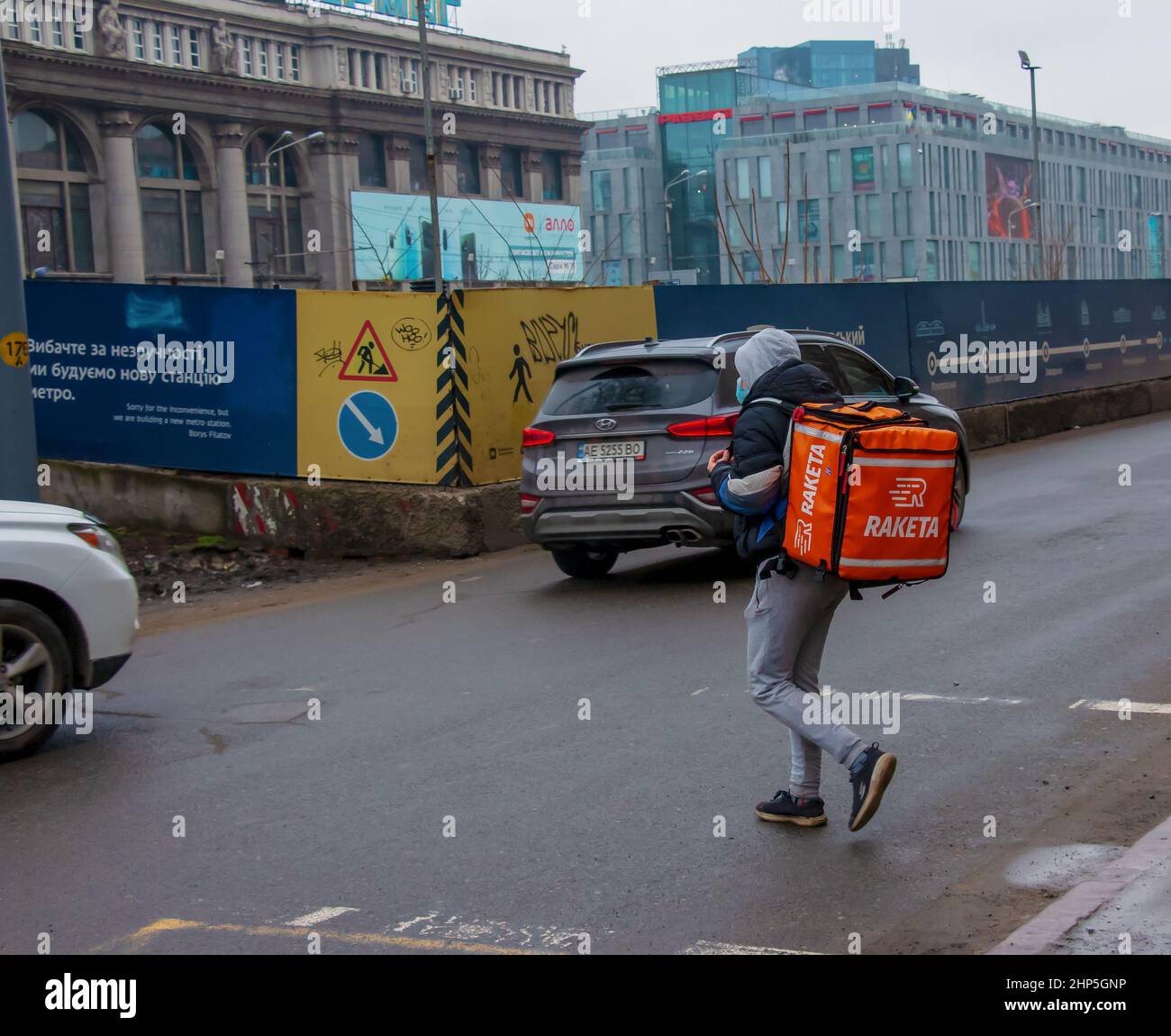 Dnepropetrovsk, Ukraine - 02.10.2022: A delivery service courier with a ...