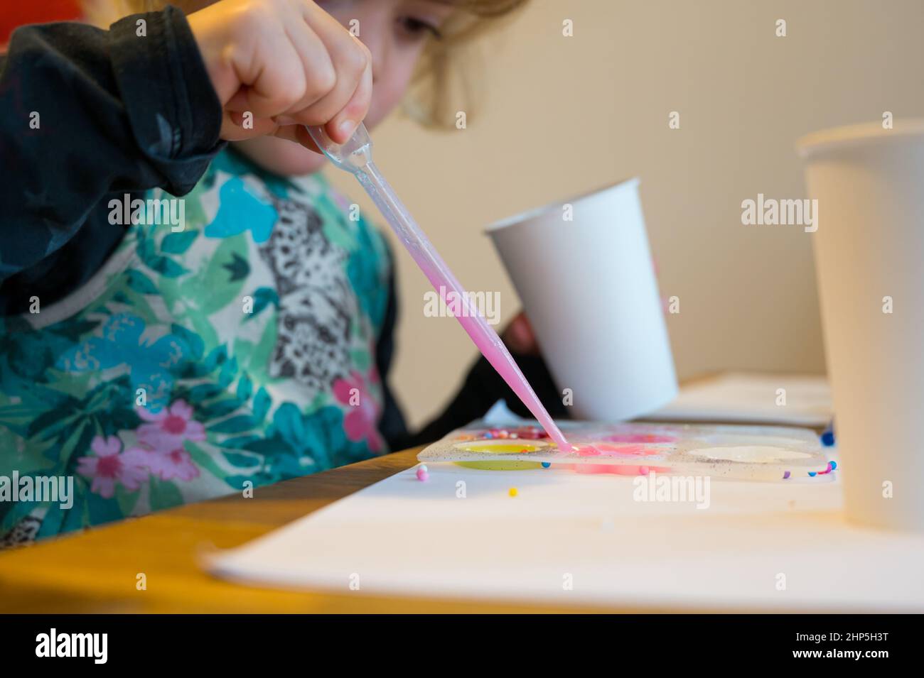 Cute blonde girl creating beautiful epoxy resin jewelry Stock Photo - Alamy