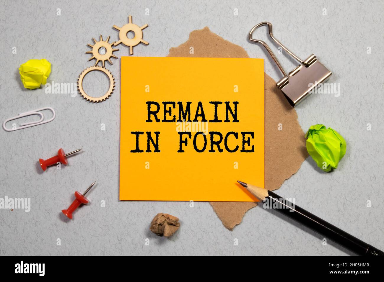 text remain in force on torn paper Stock Photo - Alamy