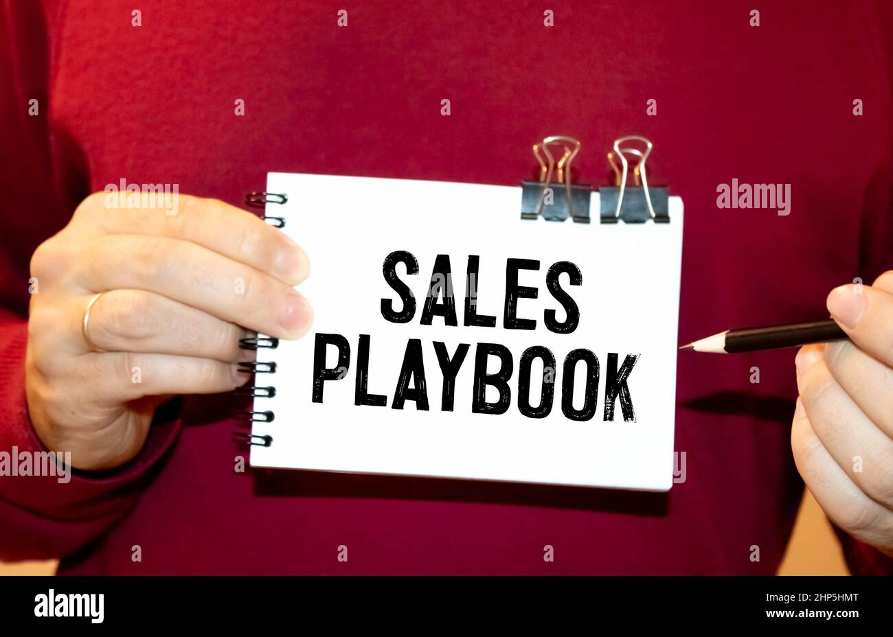 sales playbook text on paper on the chart background with pen Stock ...