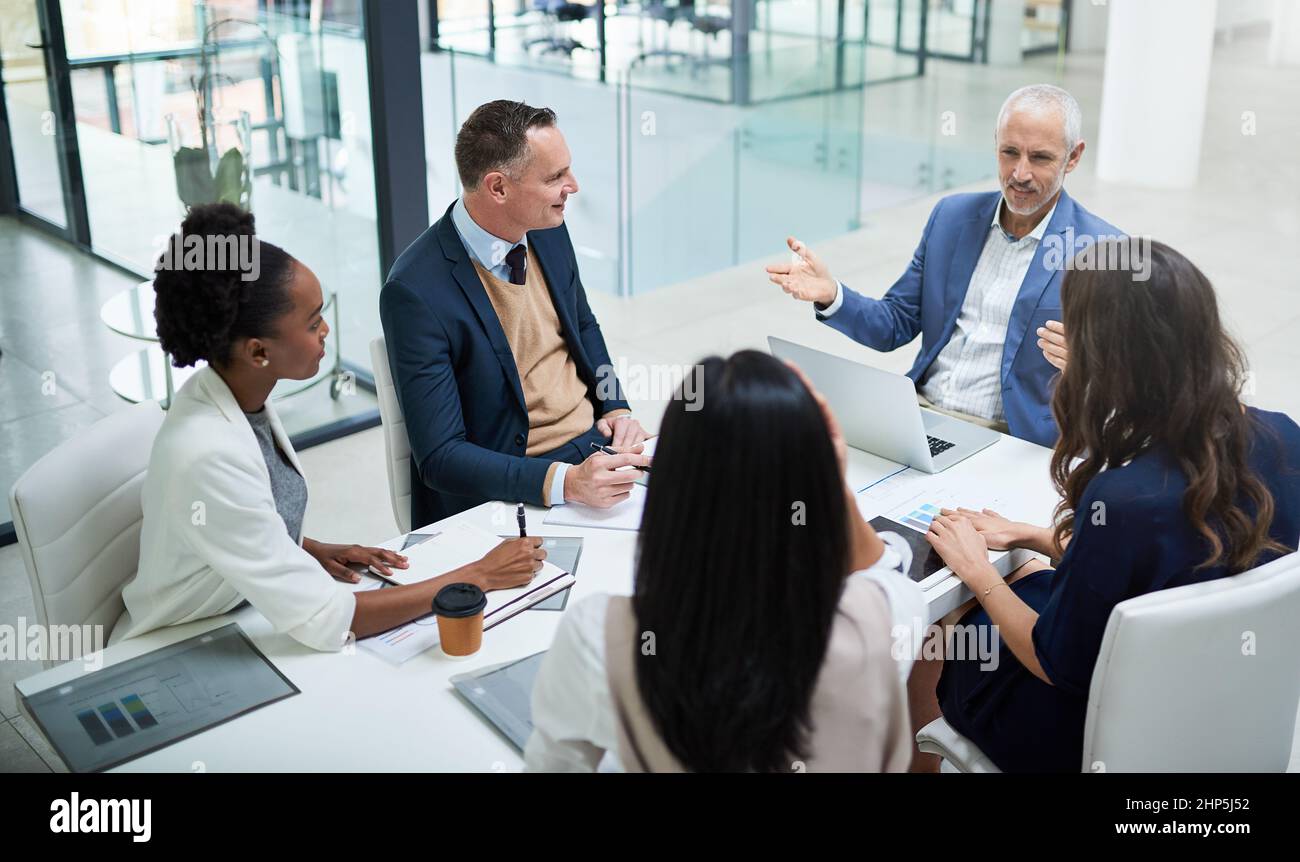Taking charge of business. Cropped shot of businesspeople having a ...