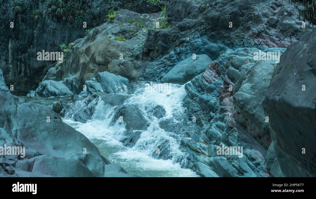Photo shows a rocky gorge in which a mountain river flows. River flows ...