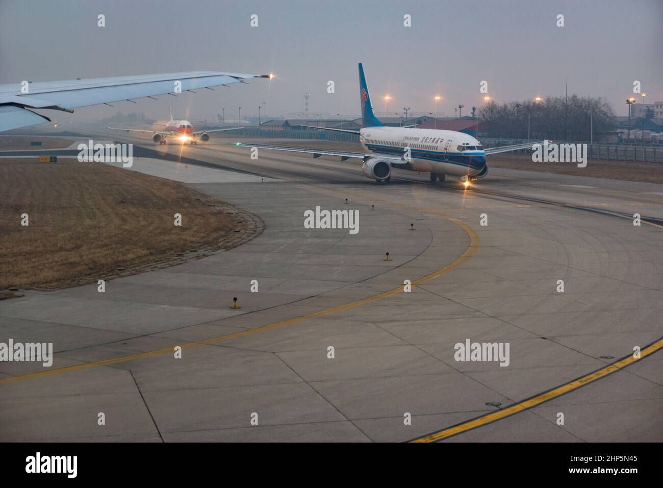 Airplanes in runway waiting for takeoff, Beijing International Airport ...